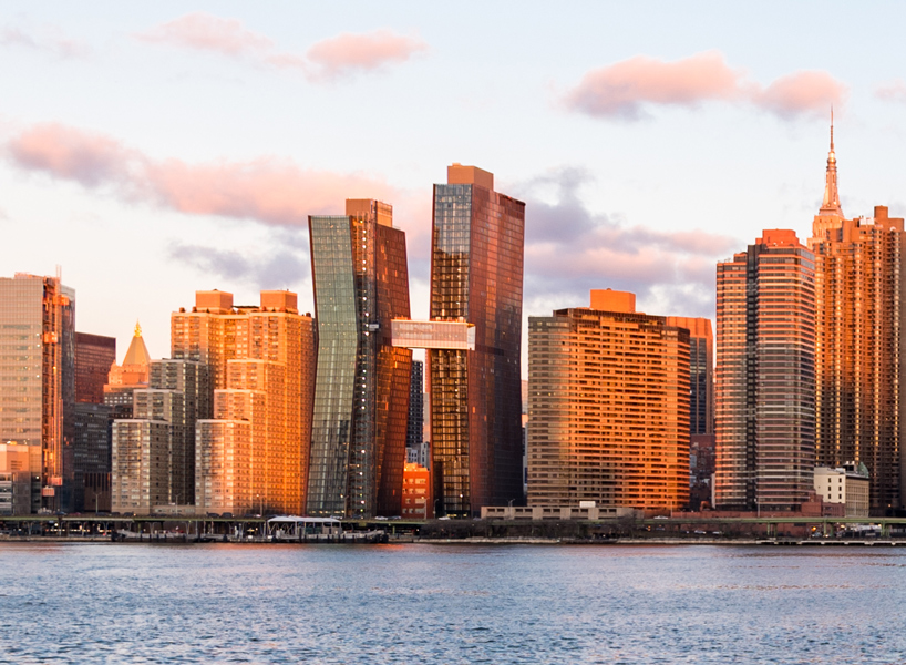 standing at 41 and 48 stories, the two copper-clad towers contain a ...