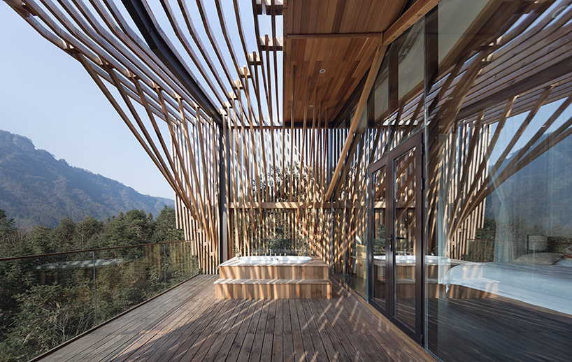 lanD studio completes treehouse M with inverted roof in china