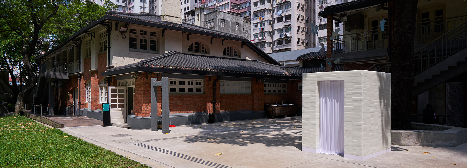 daydreamers design installs wax confessional booth in hong kong