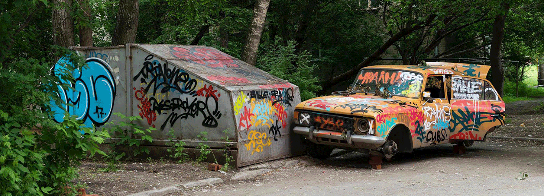 artists 'erase' graffitied car with painted photoshop transparency pattern