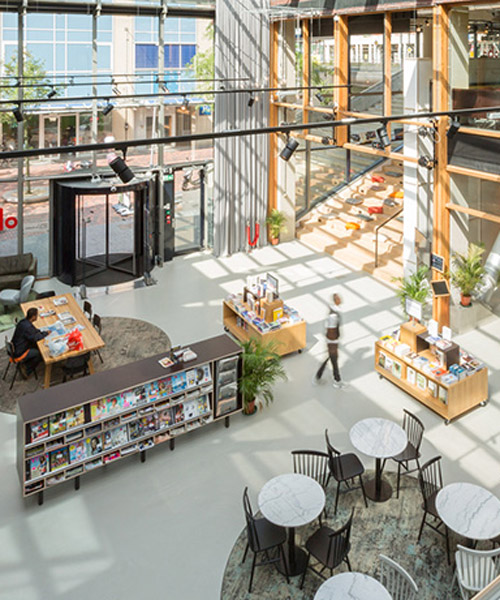 aat vos' new library has an inviting character with a high entrance and ...