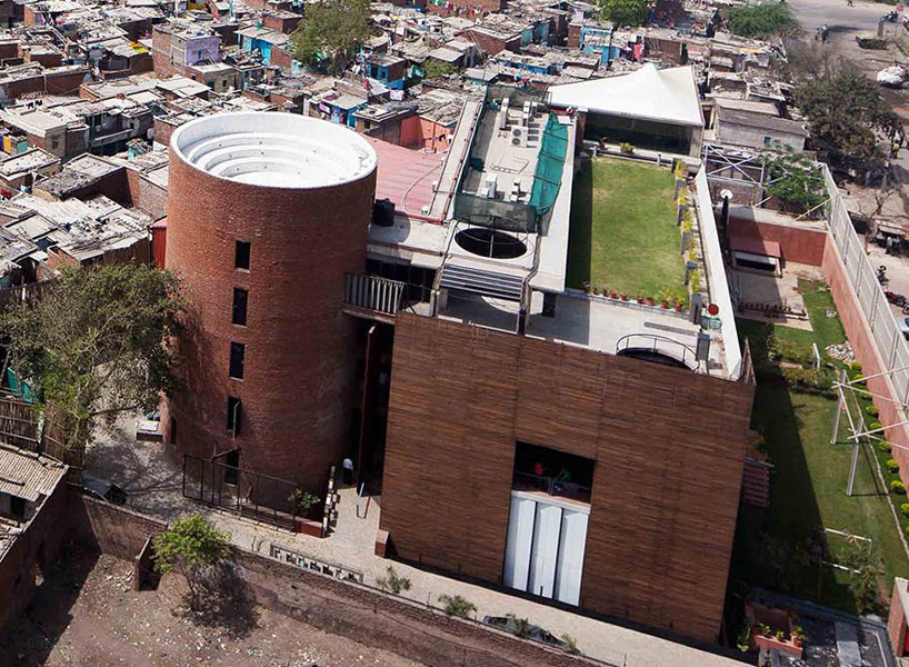 the main building is divided into five near platonic and bold volumes ...