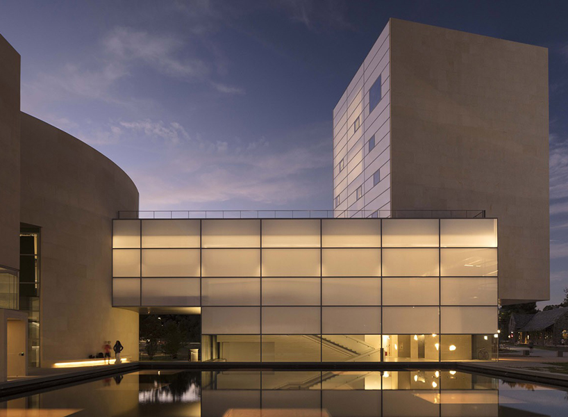 the complex comprises three distinct buildings that are connected below ...