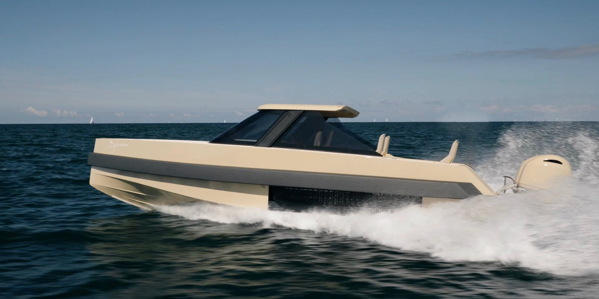 iguana's commuter amphibious yacht drives out of the sea onto the beach
