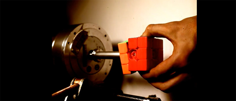watch this robot solve a rubik's cube in under a second