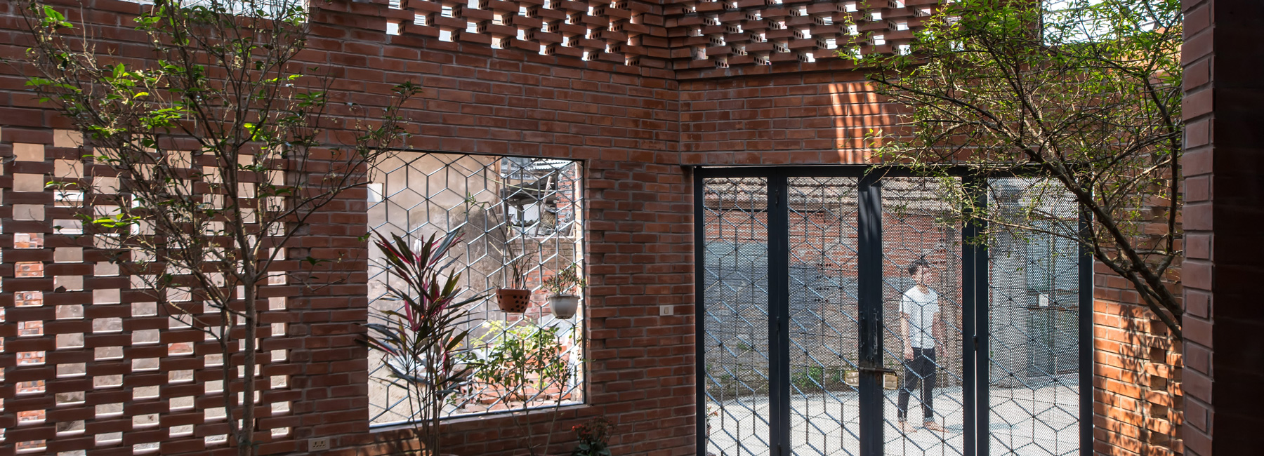 this vietnamese townhouse is an urban brick cave that simulates nature
