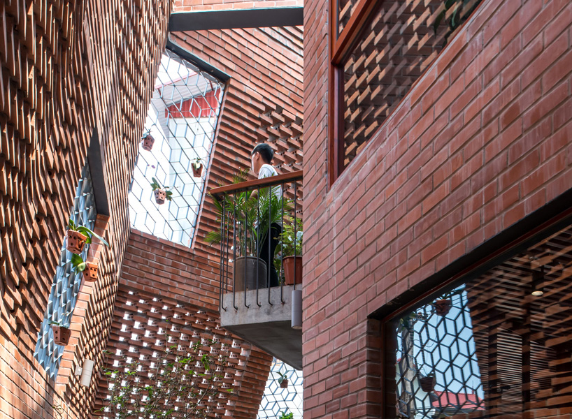 this vietnamese townhouse is an urban brick cave that simulates nature