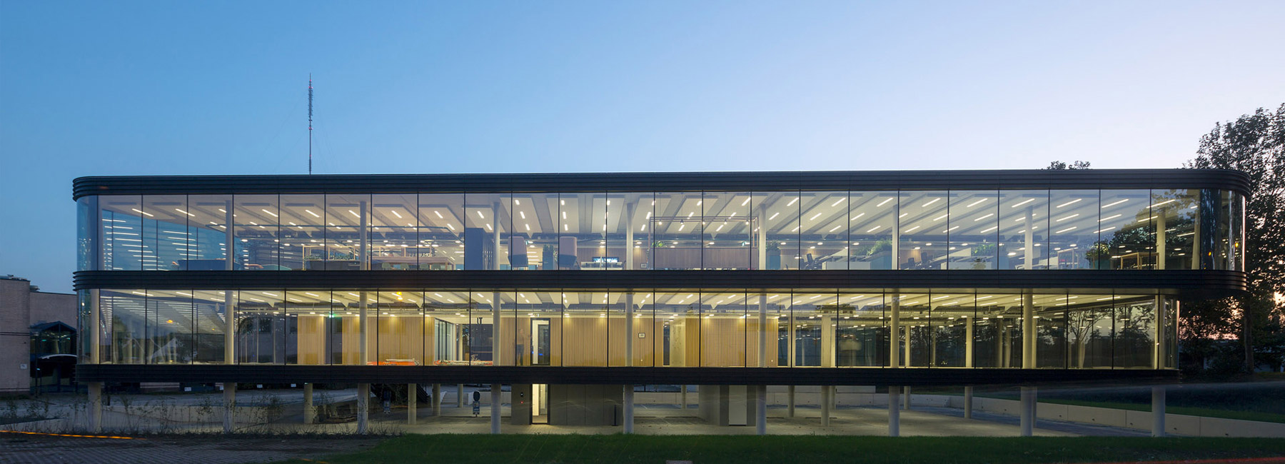 EVA architecture designs flowing glass-covered sustainable building in ...