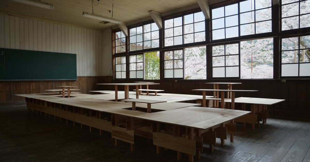 wooden platform by td-atelier turns old classroom into multipurpose space