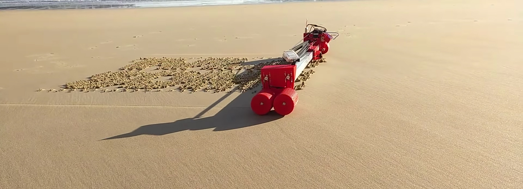 this engineer built a robot to turn beach into giant etch-a-sketch