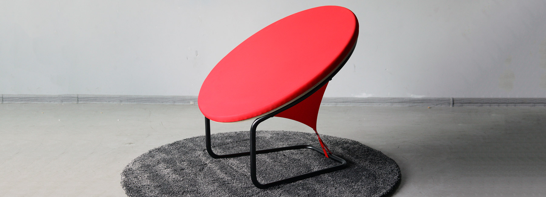 gaudutė žilytė's red dot chair is reminiscent of works by anish kapoor