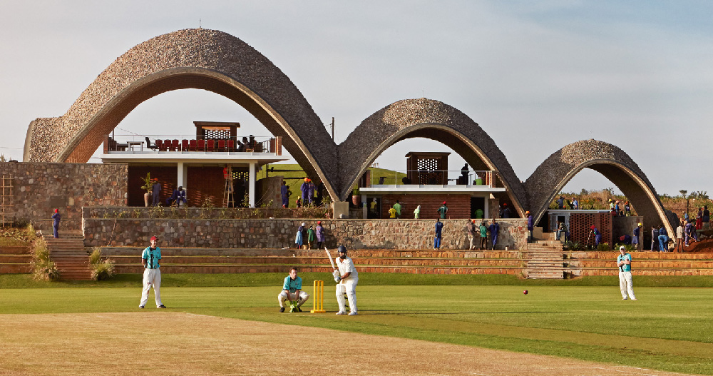 pavilion at rwanda cricket stadium mimics the movement of a bouncing ball