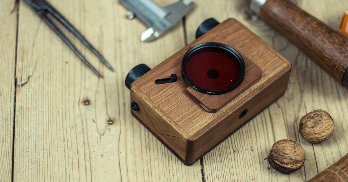 a wooden camera with no lens, no mirror and no batteries