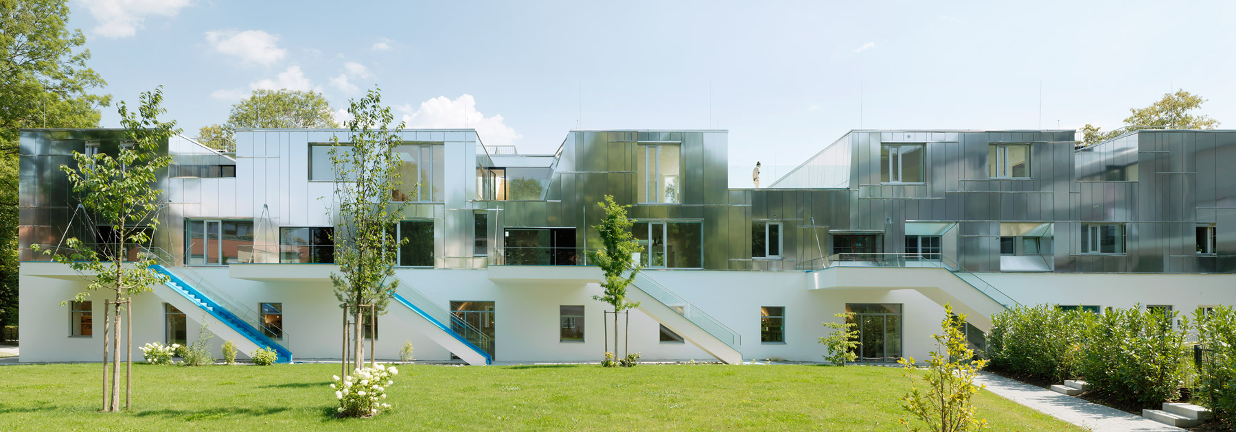 peter ebner combines metal and stucco for gestüthalle building in salzburg