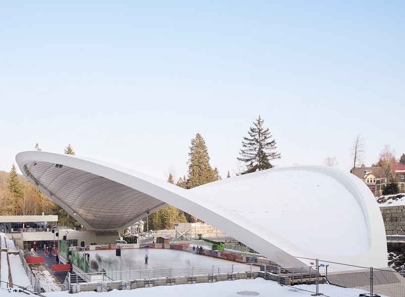 graft constructs dramatic curved roof over feuerstein arena in germany ...