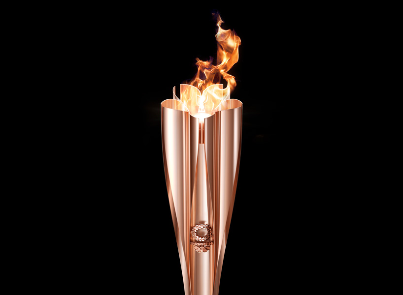 the shiny rose-gold torch, uses the waste from temporary housing built ...