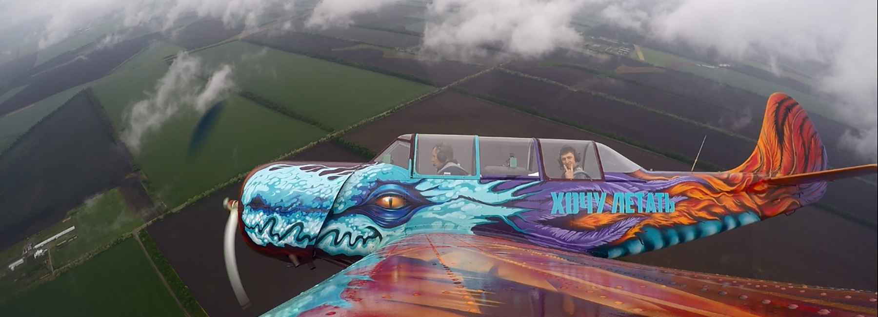 graffiti airplane dragon takes to the skies (a spray painted yak 52)