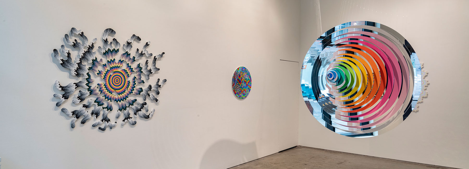 jen stark transforms new york city gallery into kaleidoscope of color