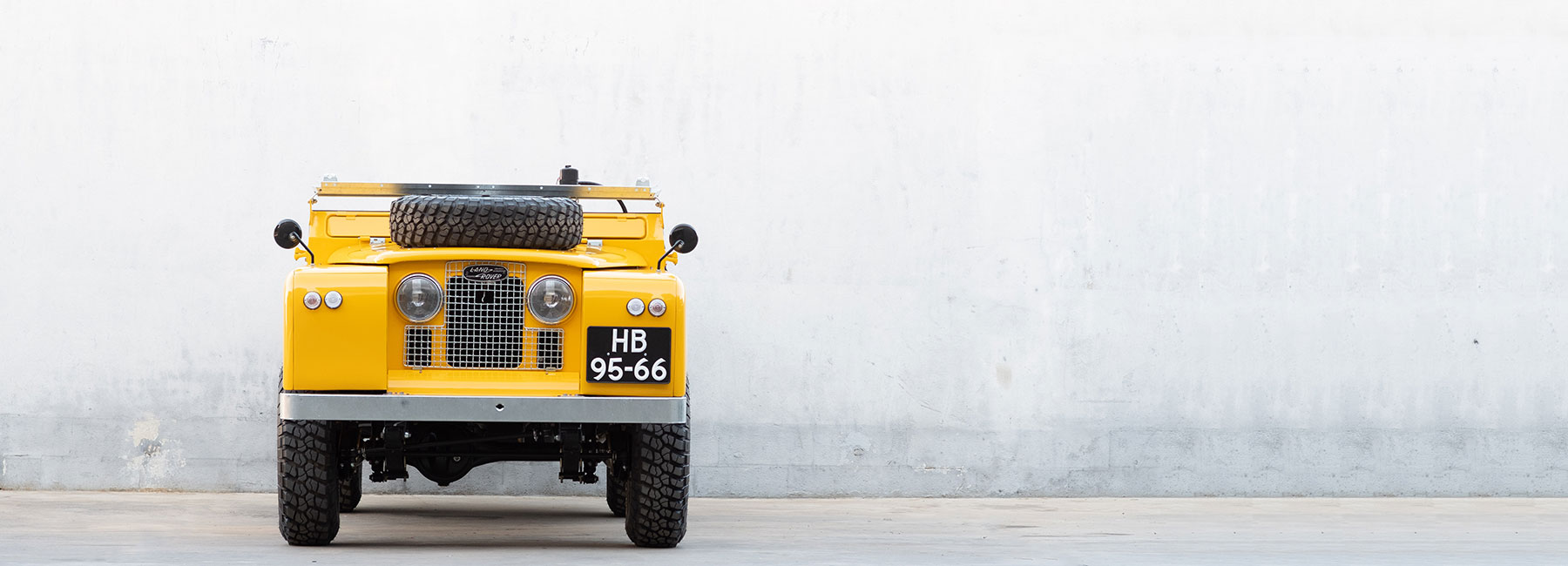 coolnvintage and deus ex-machina present a motorcycle hauling land rover