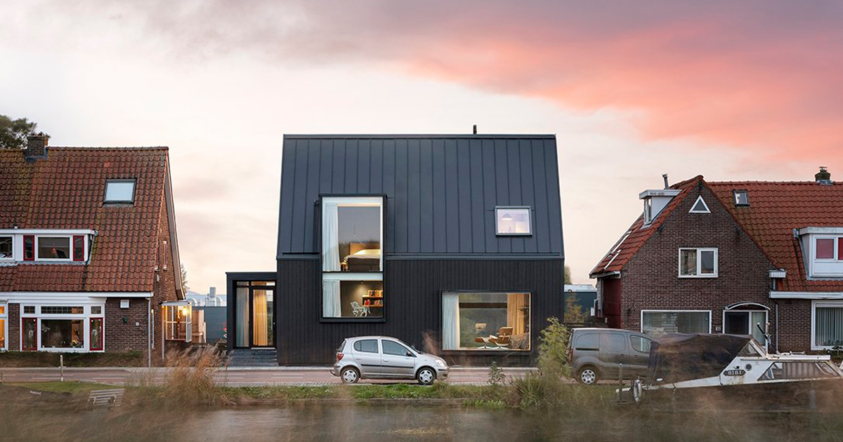 blackened timber clads arjen reas architects' dyke house in the netherlands