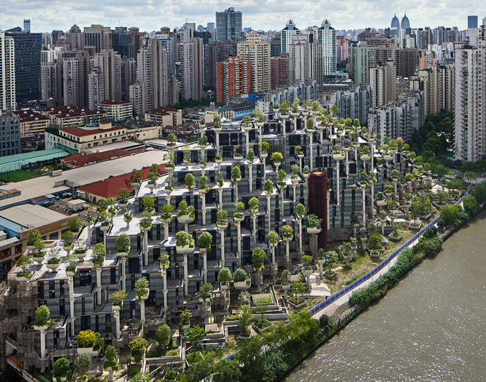 taking the form of two tree-covered mountains, the project has been ...