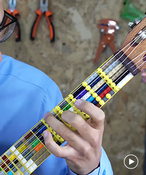 LEGO guitar built by musician features playable colorful brick fretboard