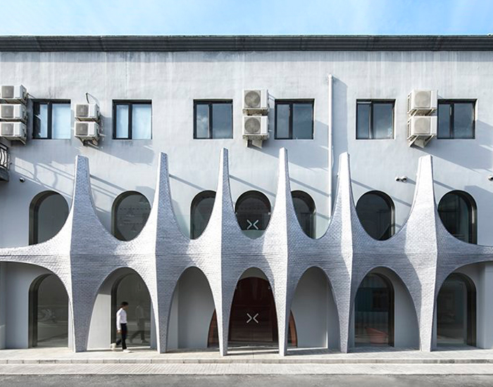 the architects converted an old factory using contemporary finishes in ...