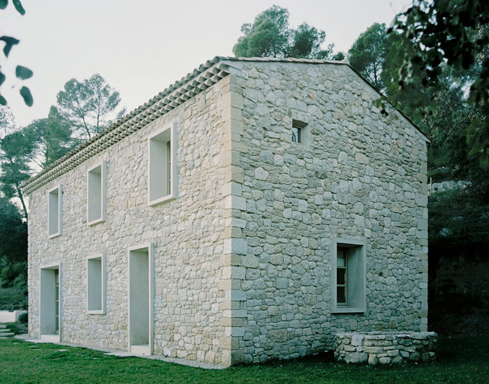 the house is designed as an intimate refuge buried in the hills.