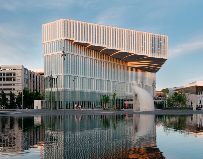 the cantilevered floors are suspended from the roof, which has a ...