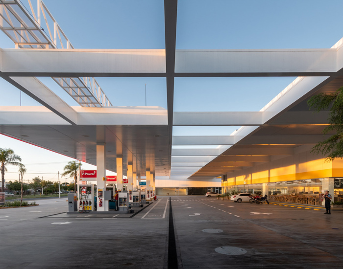 rancagua station is designed beneath a gridded, long-spanning roof surface.