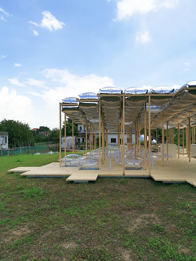 timber oasis gulao tea alcove emerges from the fish ponds of china