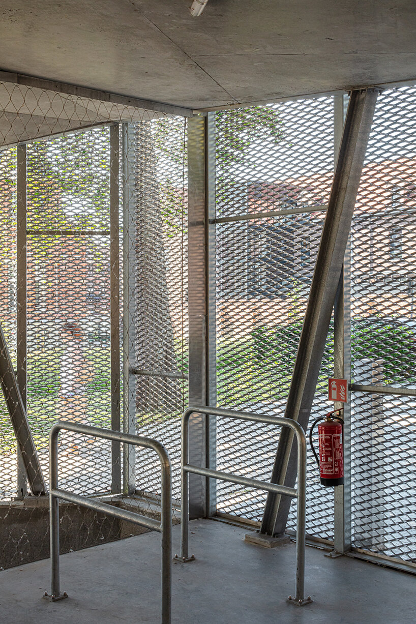 WAW architects builds bicycle pavilion wrapped in a mesh metal box