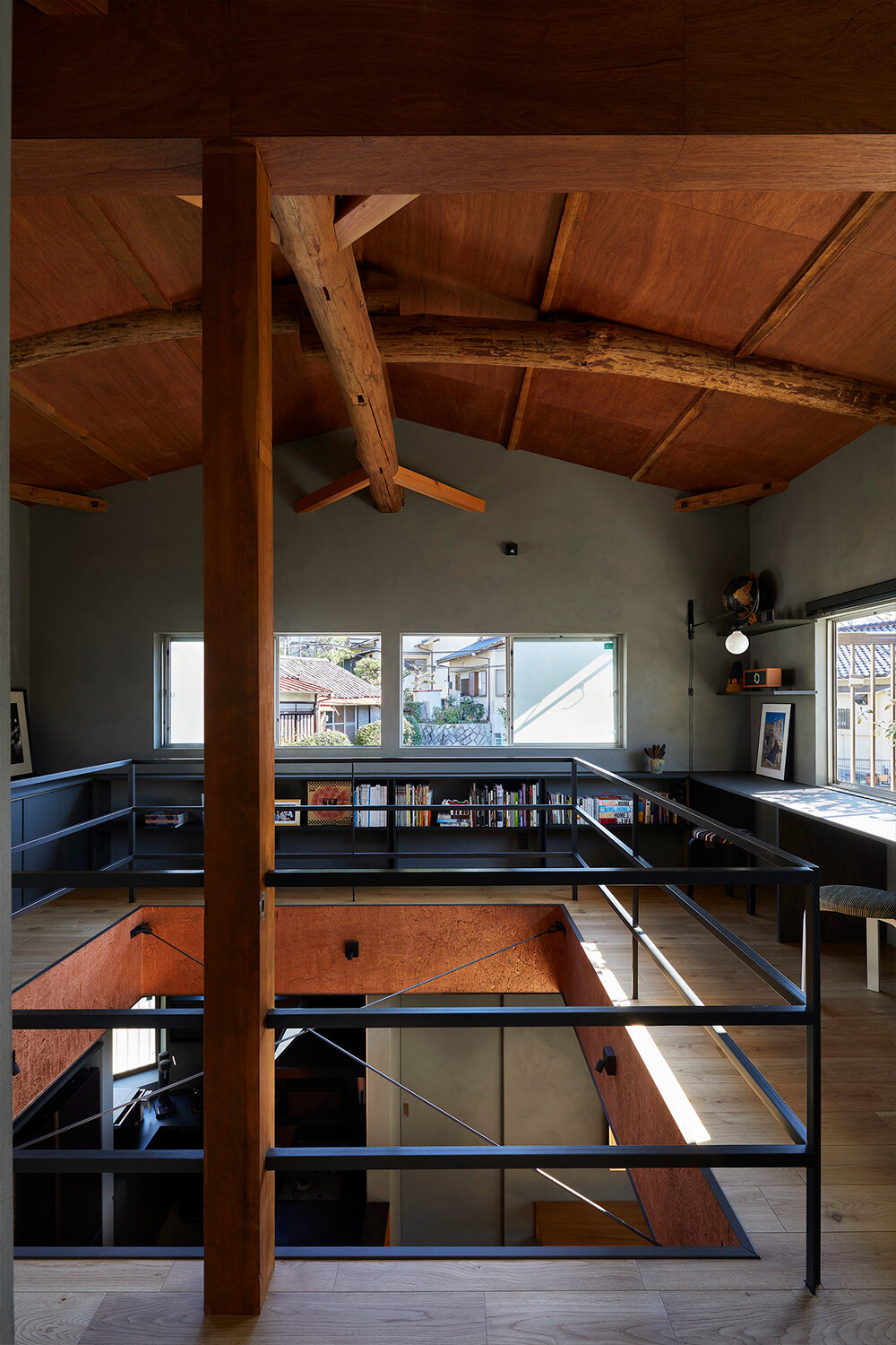 a double height void cuts through this house in japan