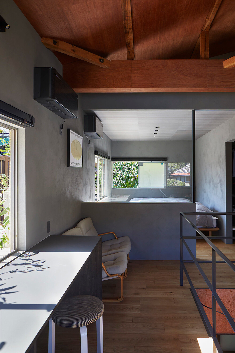 a double height void cuts through this house in japan