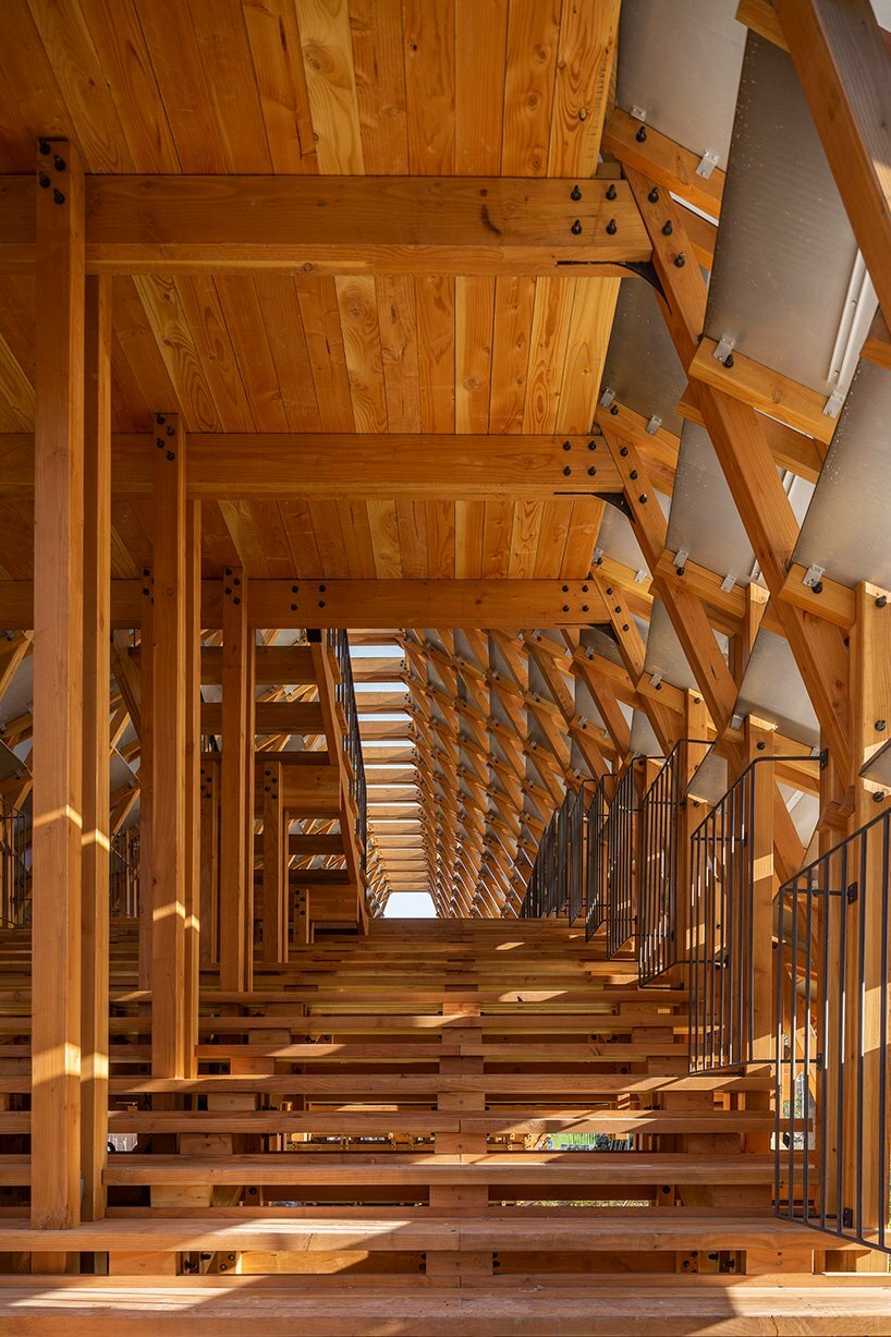 LUO studio extrudes arched timber bridge in china to revitalize ...