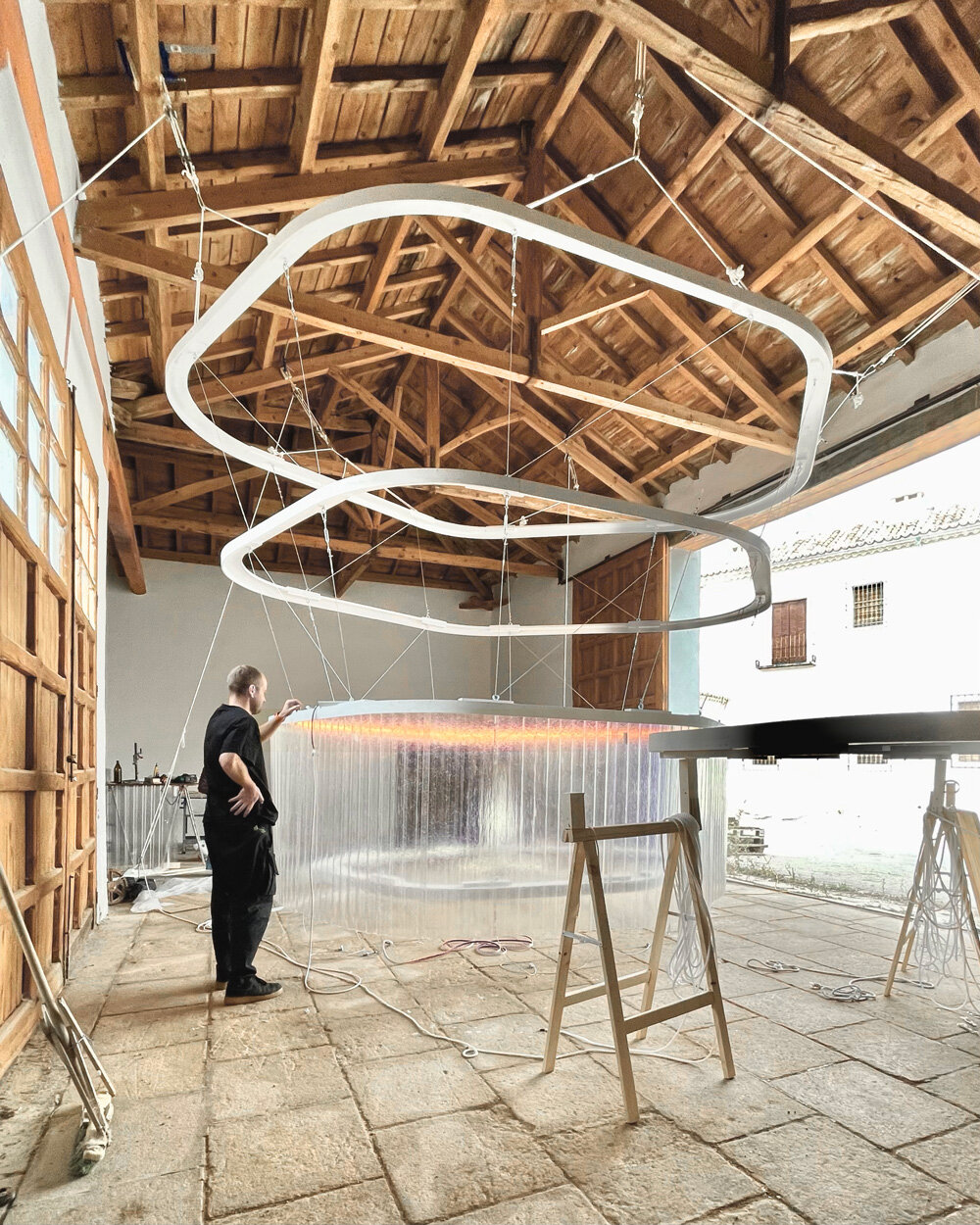 monumental lamp installation lights up the main patio of a 17th century ...