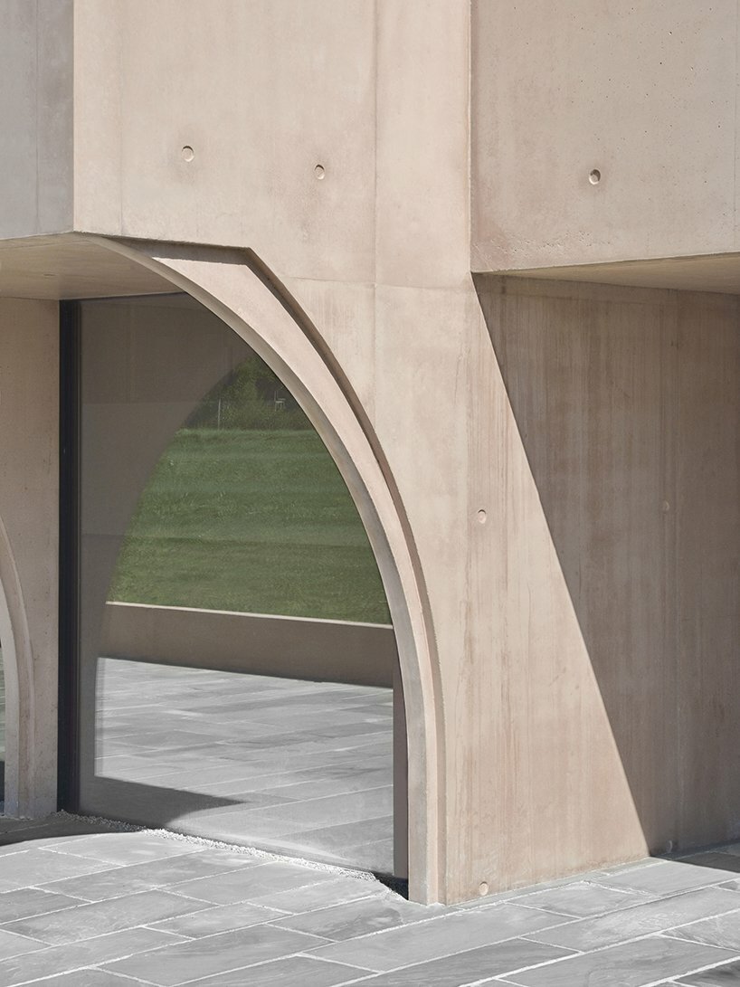 a series of half arches carve cultural center by tracks archtectes in ...