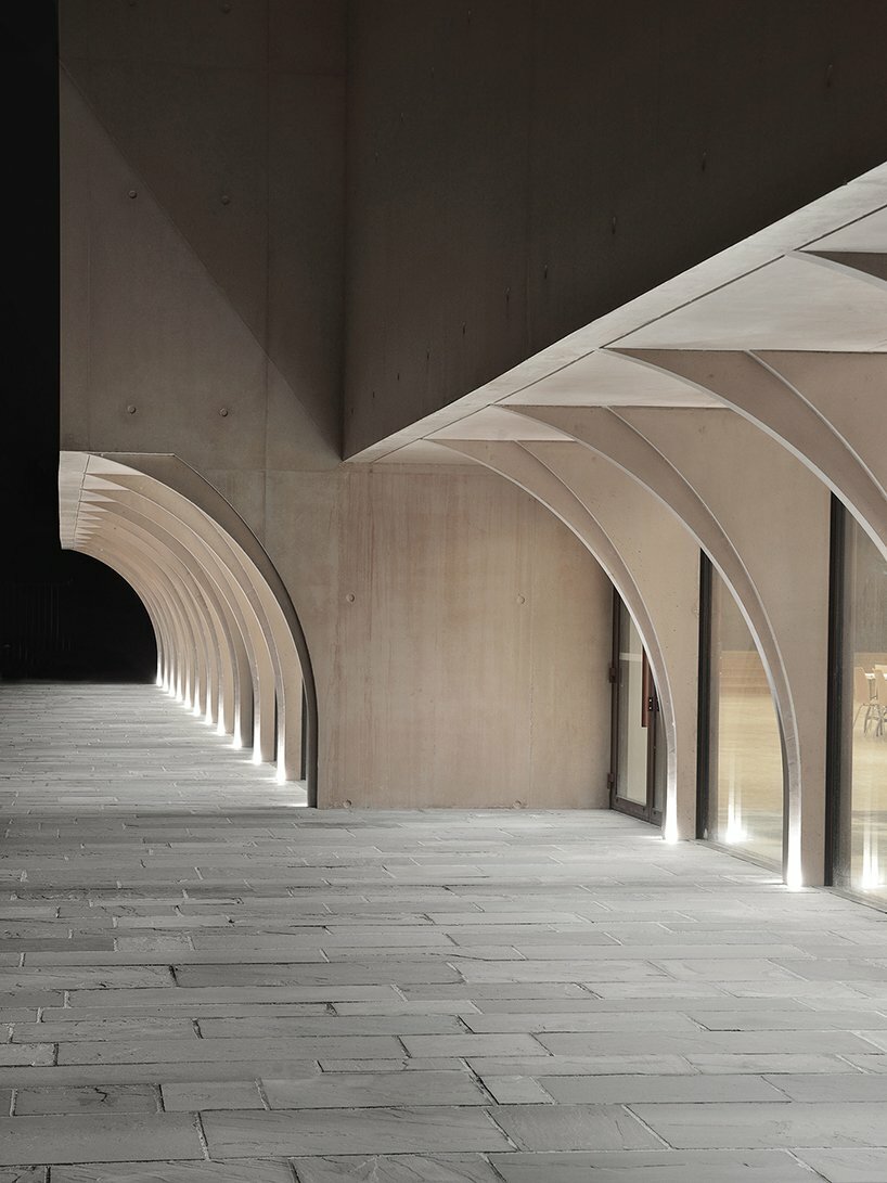 a series of half arches carve cultural center by tracks archtectes in ...