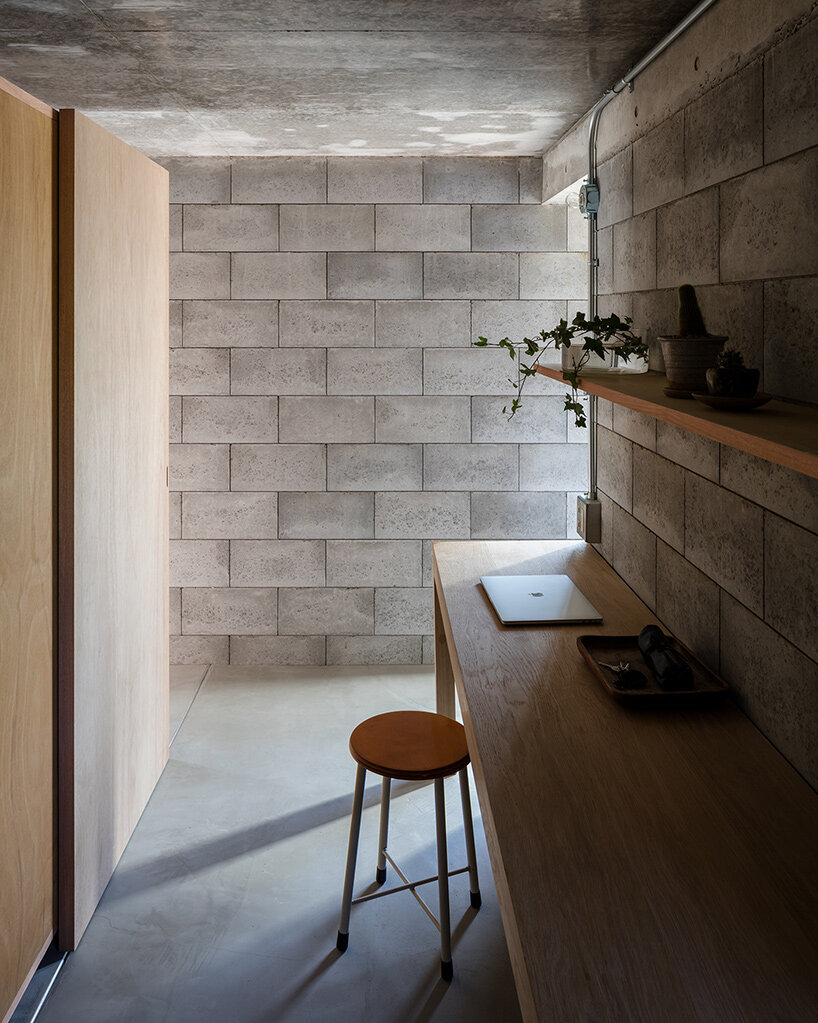 KKAA TYAA tops concrete 'house of joy' with warm timber roof