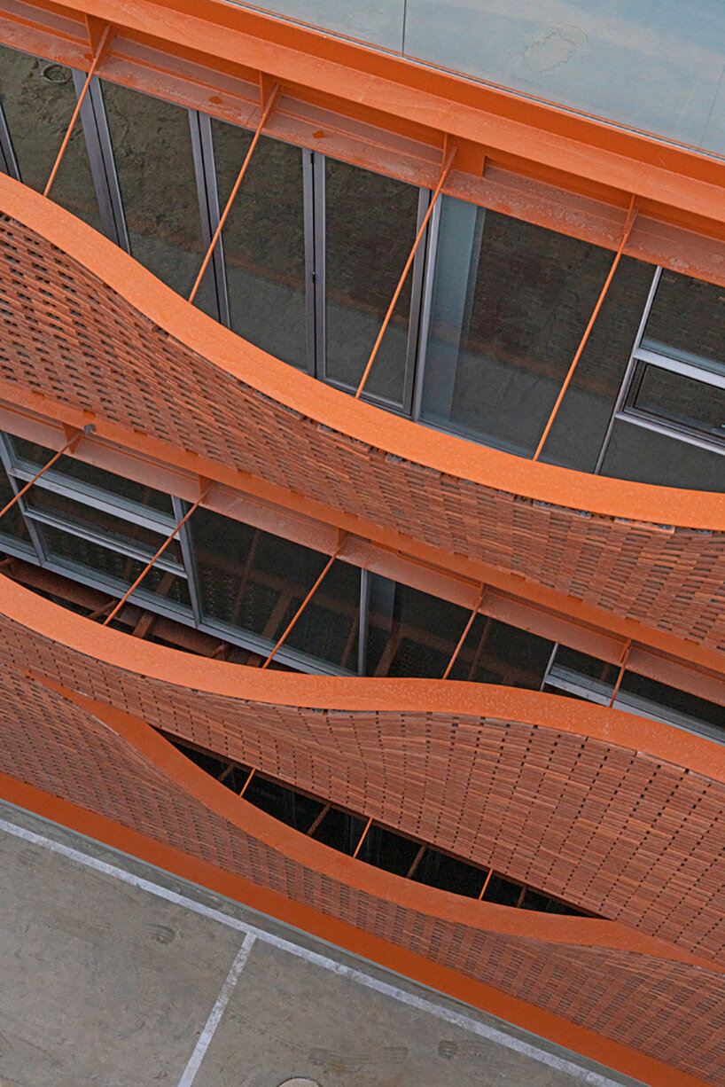 undulating red brick facade envelops 'wave' commercial building by JYA ...