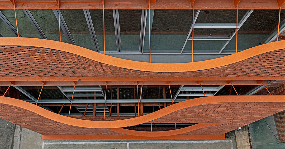 undulating red brick facade envelops 'wave' commercial building by JYA ...