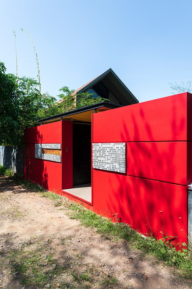 repurposed factory tiles & pivoted glazing define residence in india