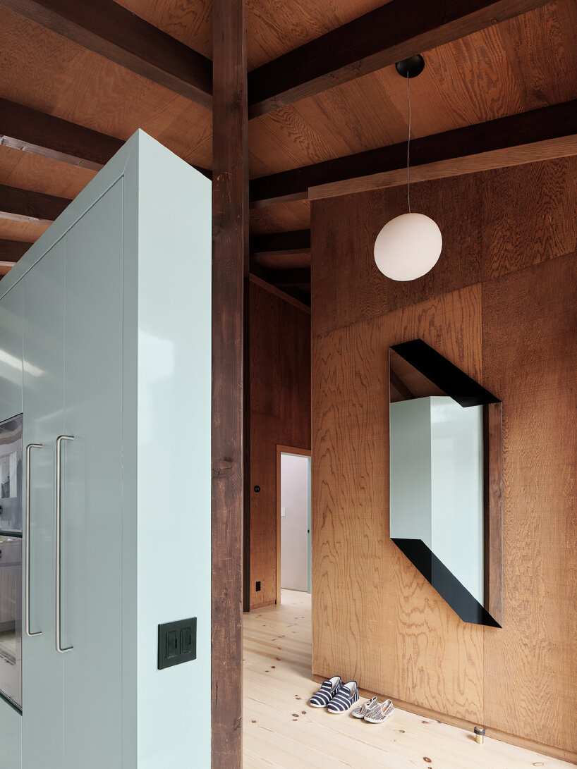 studio terpeluk blends redwood with marble, terrazzo, & soft tones in ...