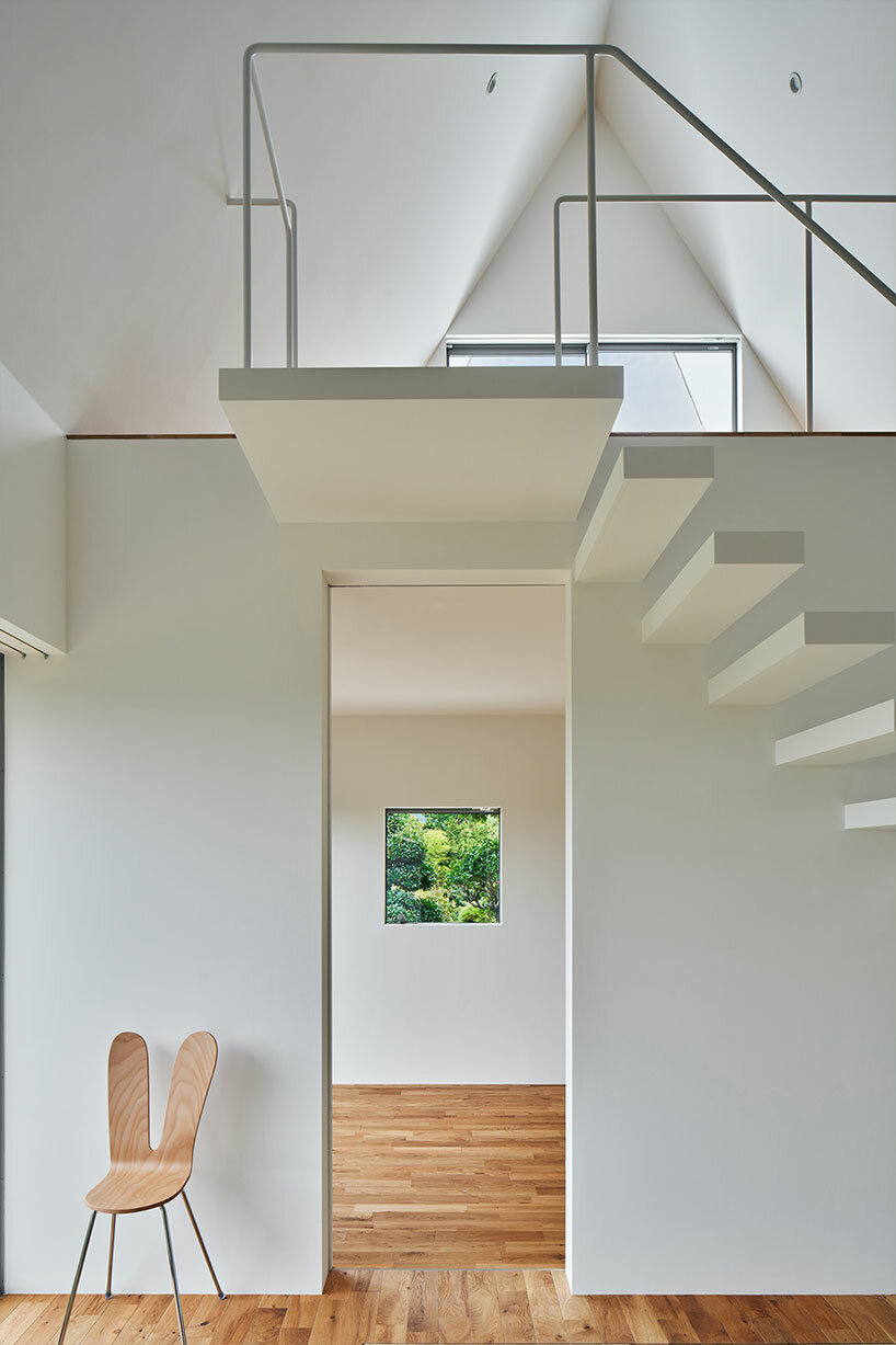 cut-out triangular roof frames extensive panoramas of rural japan