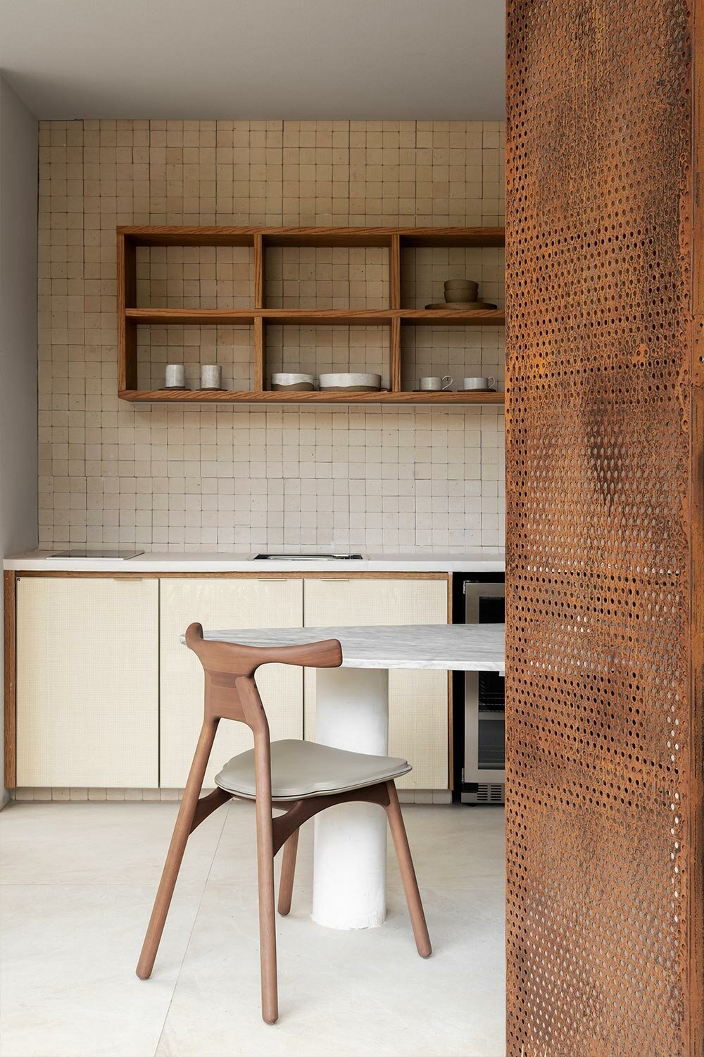 perforated louvers in corten steel clad getaway cabin in brazil