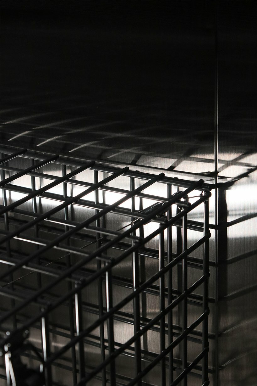 'caged light' sculpture embodies human identity in the vast universe