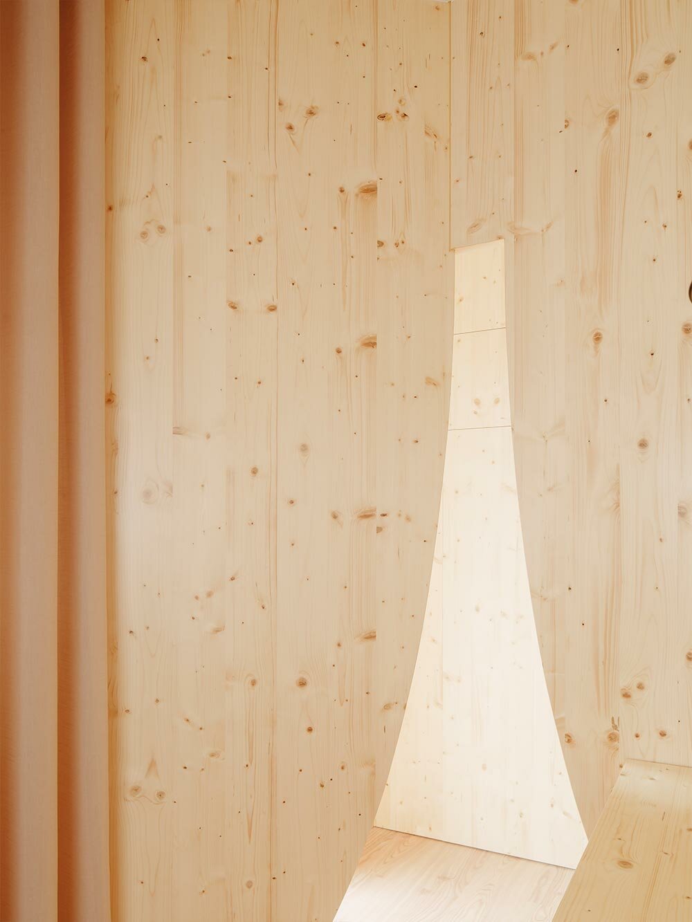 funnel-shaped cutouts finish snug restaurant in portugal