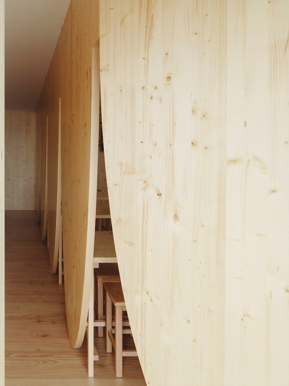 funnel-shaped cutouts finish snug restaurant in portugal