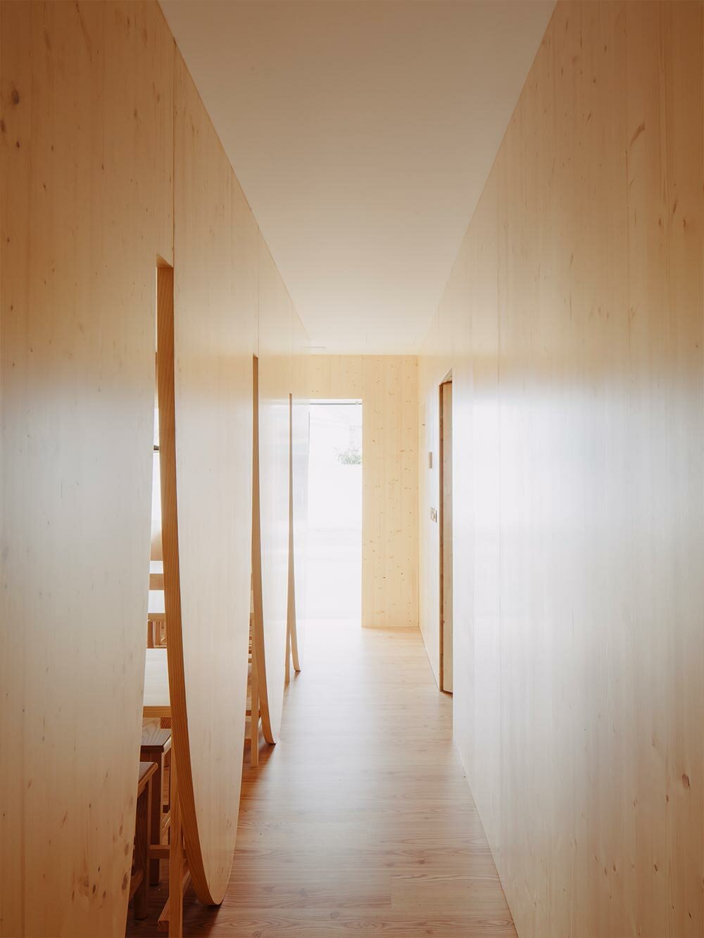 funnel-shaped cutouts finish snug restaurant in portugal