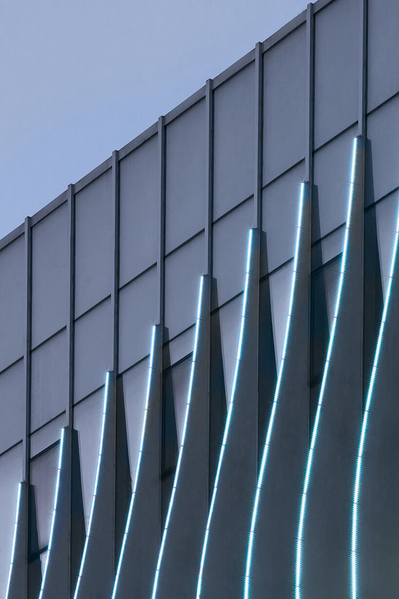 greater dog architects adorns mixed-used building with feather-shaped ...